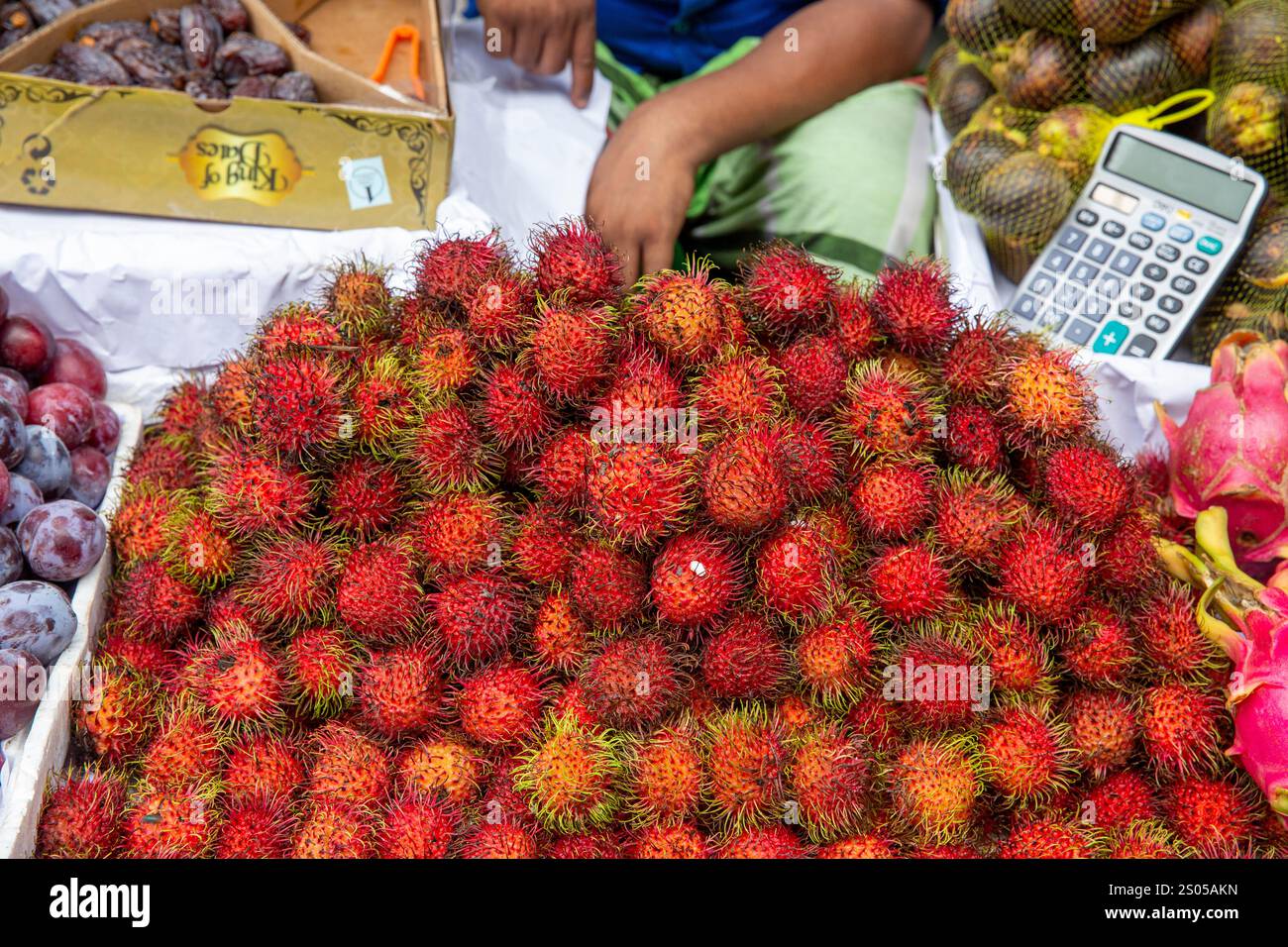 A variety of imported fruits neatly displayed at a roadside shop in ...