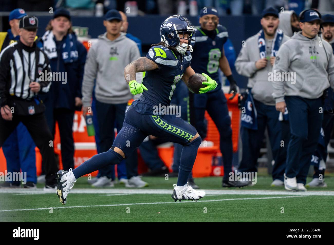 Seattle Seahawks wide receiver Jaxon Smith-Njigba runs with the ball ...