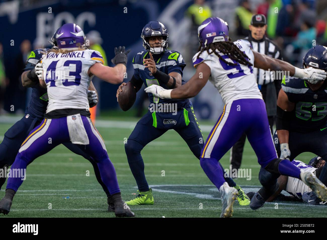 Seattle Seahawks quarterback Geno Smith looks ot pass as he is ...