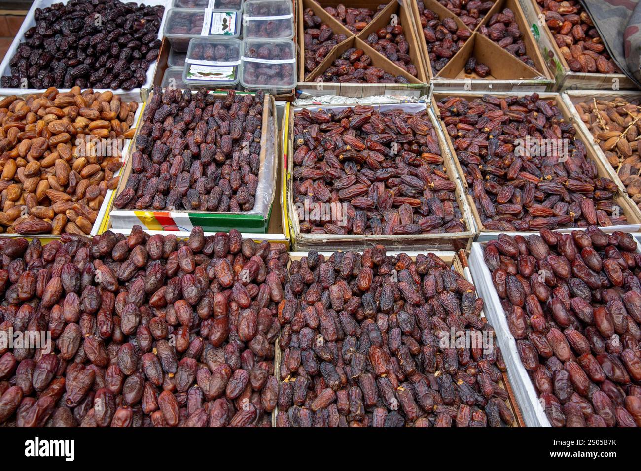 A variety of dates are beautifully displayed at a roadside shop in ...