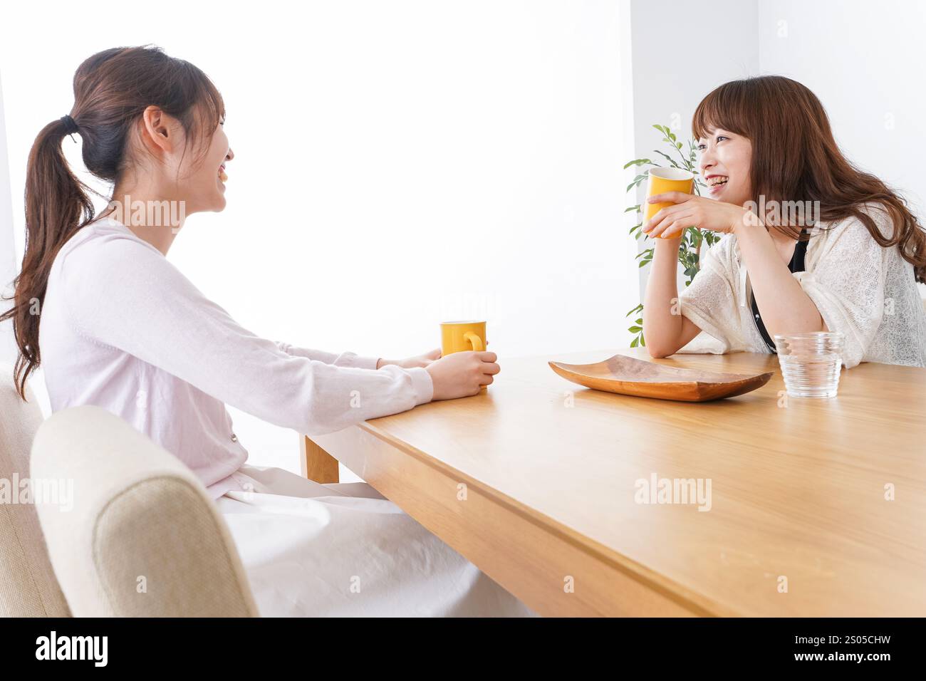 Two young people having a girls' night out Stock Photo - Alamy