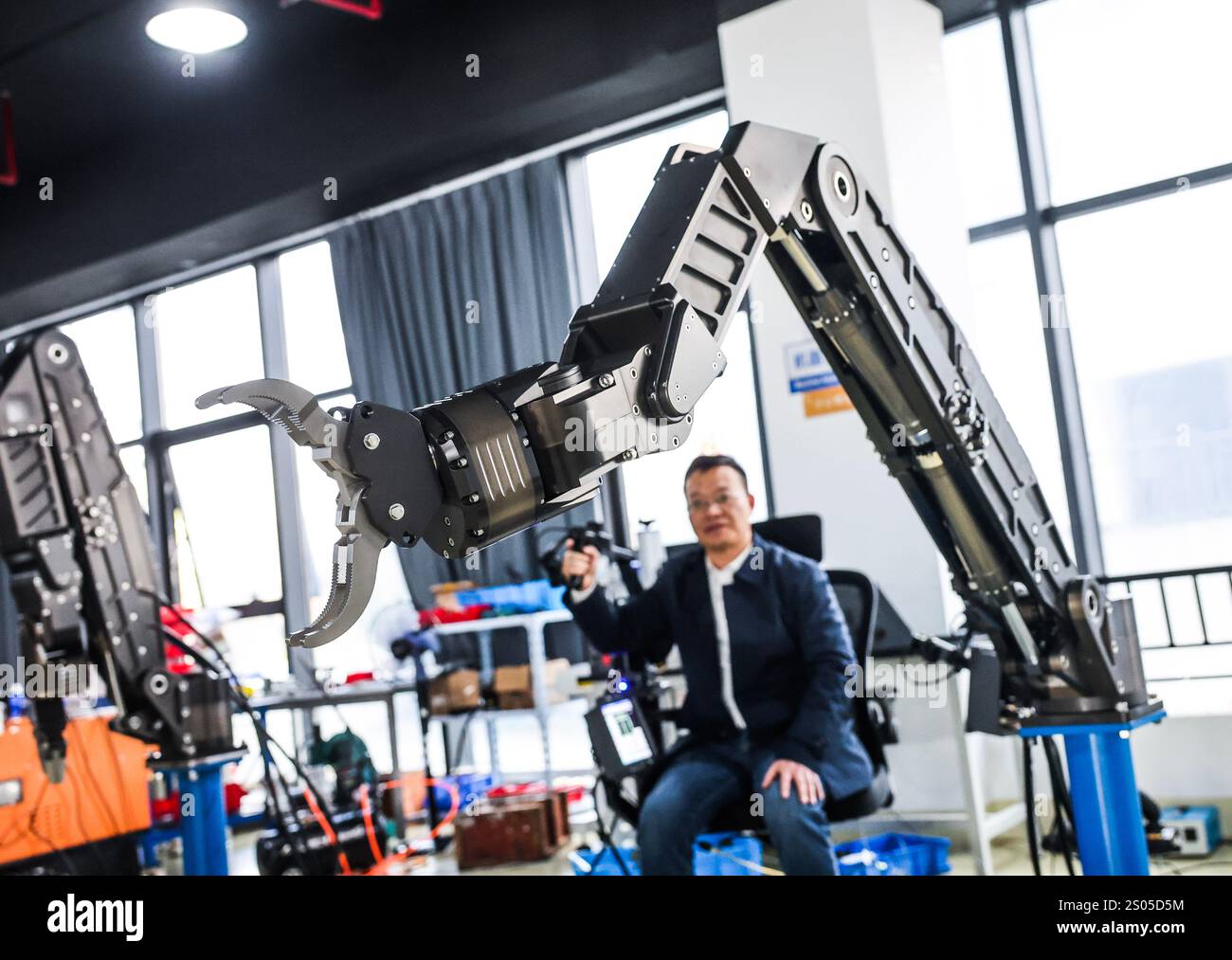 Beijing, China's Zhejiang Province. 24th Dec, 2024. A staff member ...