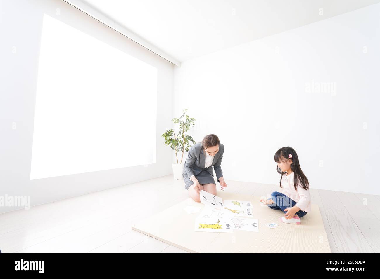 Children taking lessons from a native teacher in an English language ...