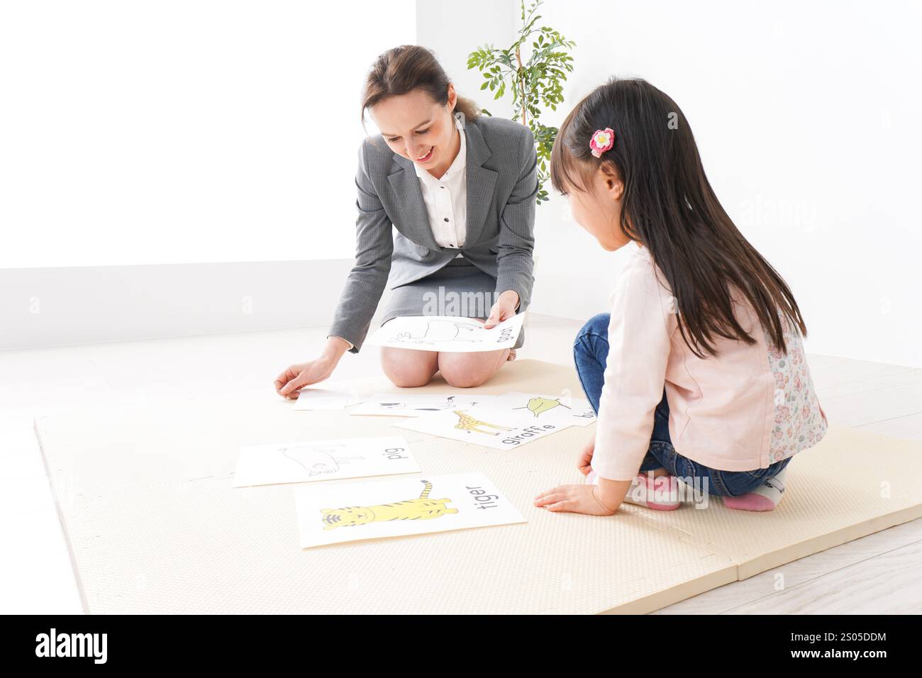 Children taking lessons from a native teacher in an English language ...