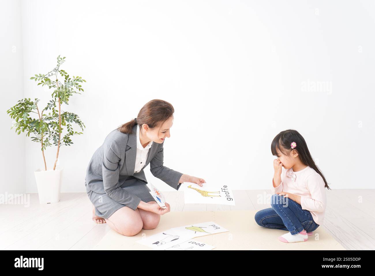 Children taking lessons from a native teacher in an English language ...