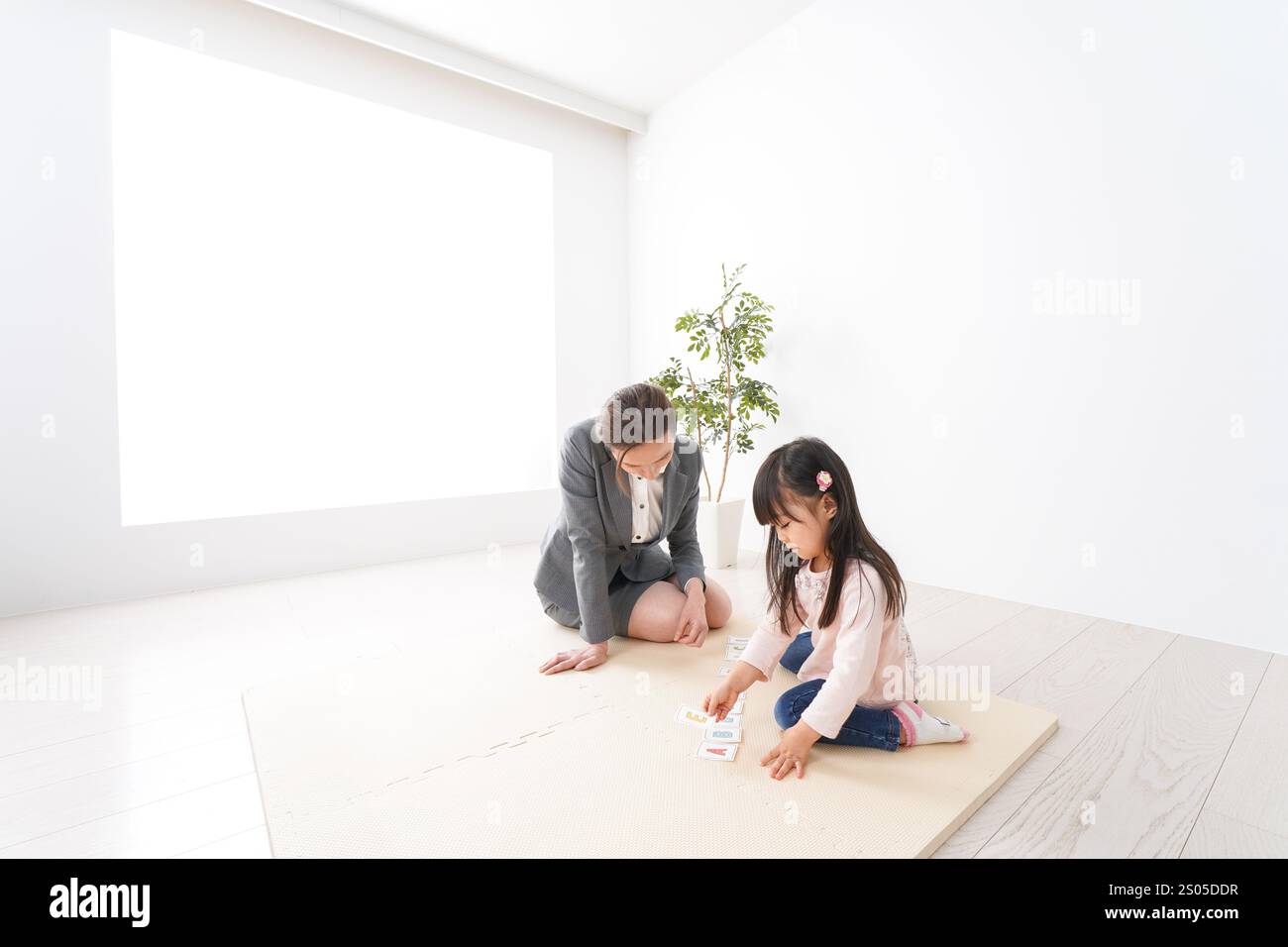 Children taking lessons from a native teacher in an English language ...