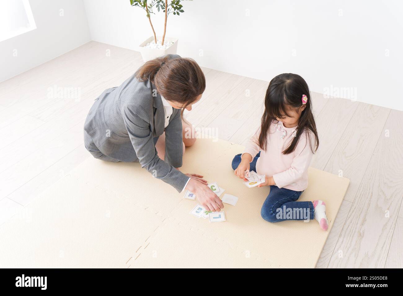 Children taking lessons from a native teacher in an English language ...