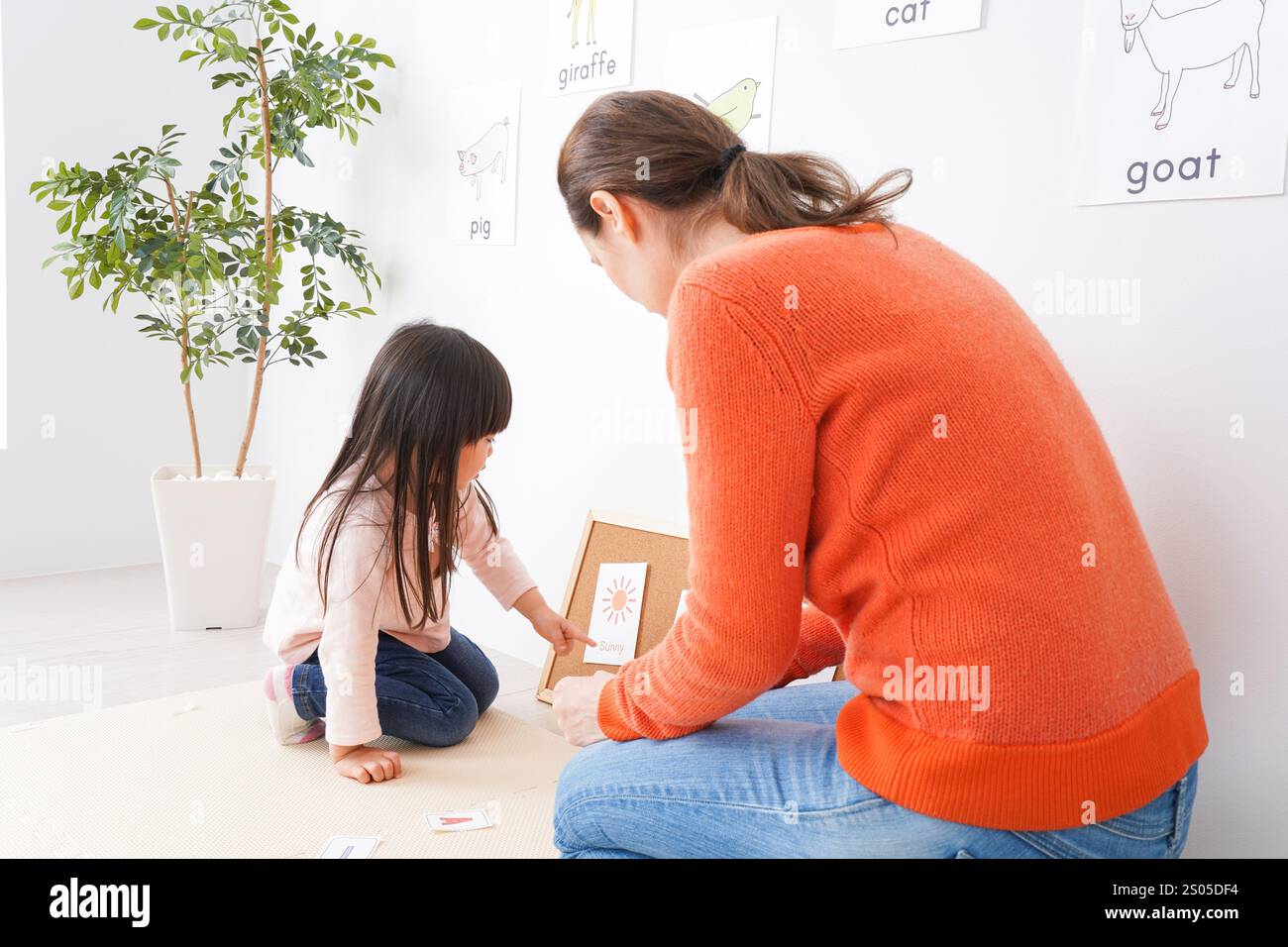 Child studying English with native speakers Stock Photo - Alamy