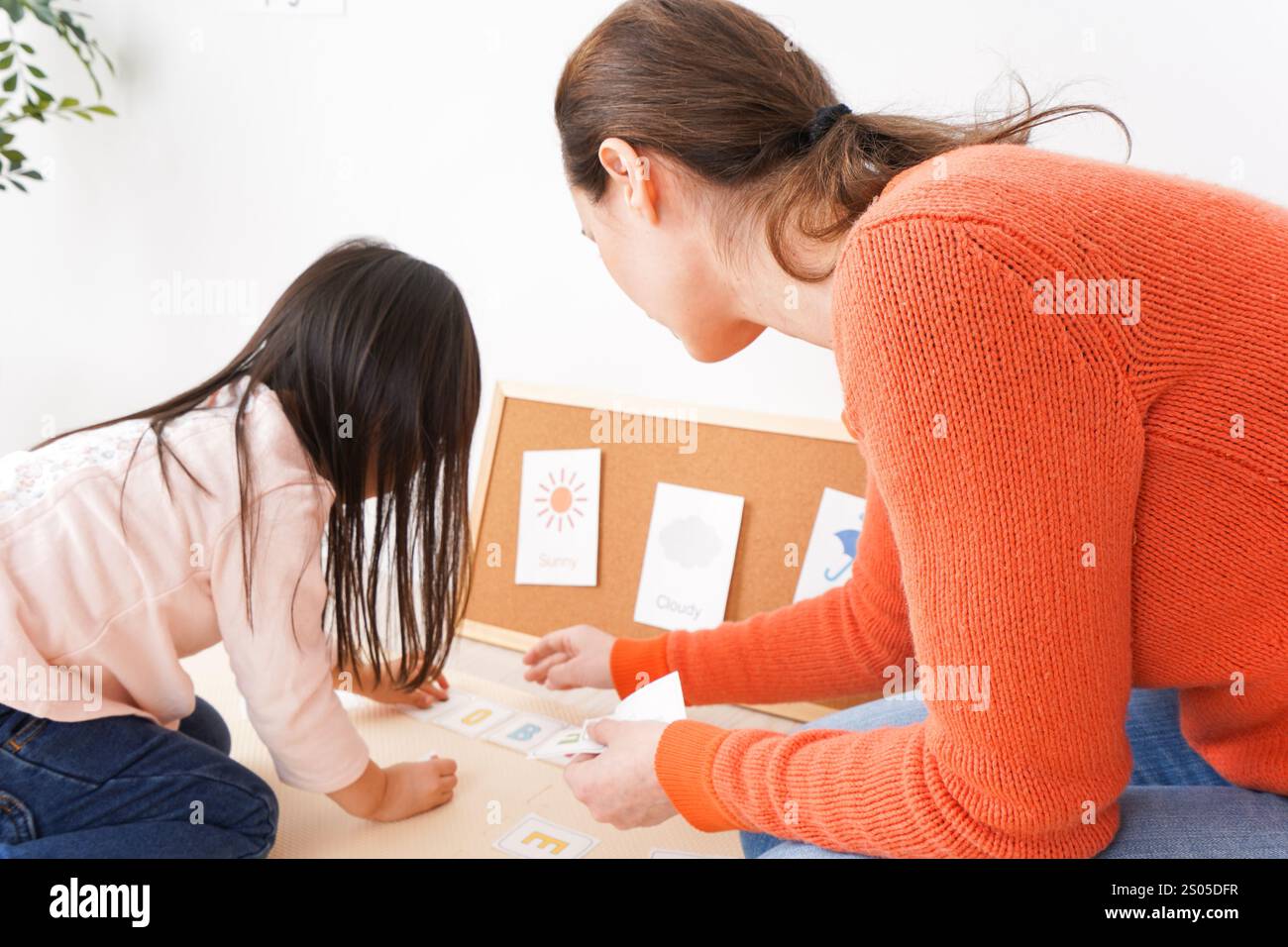 Children taking lessons from a native teacher in an English language ...