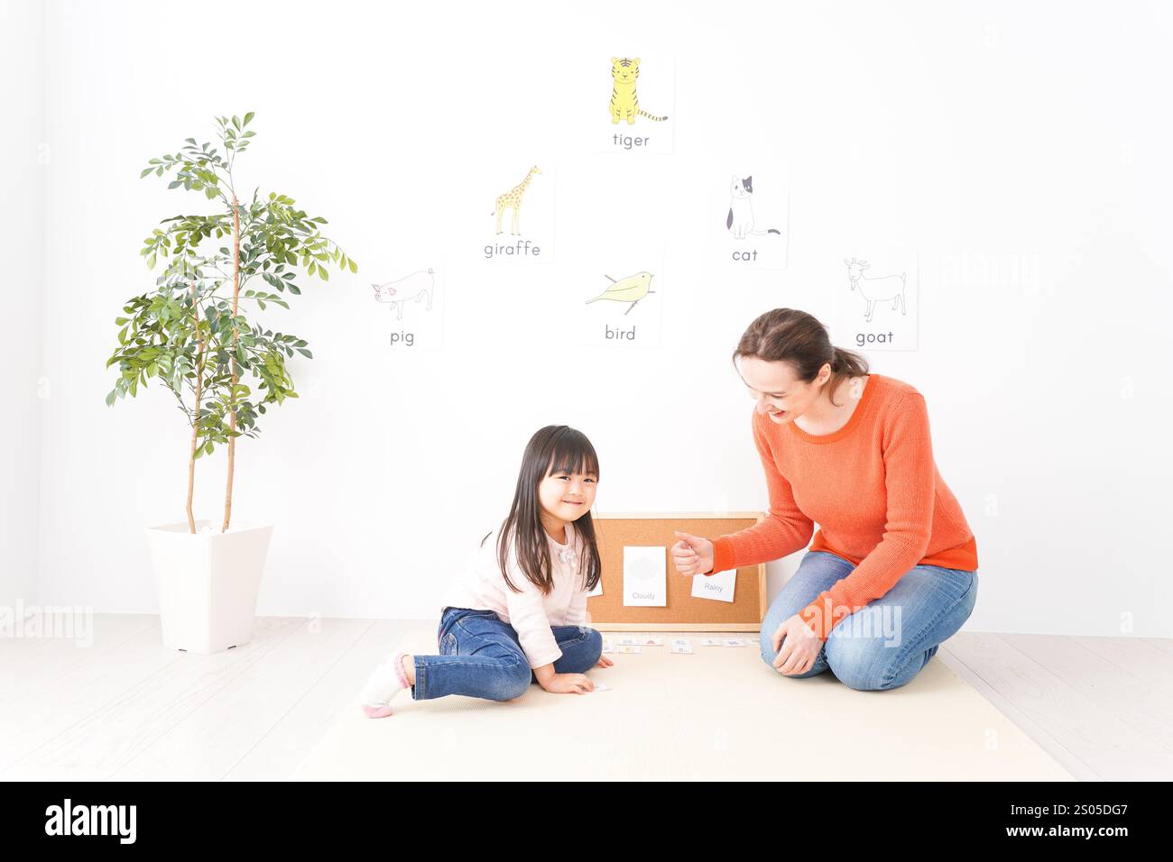 Children taking lessons from a native teacher in an English language ...