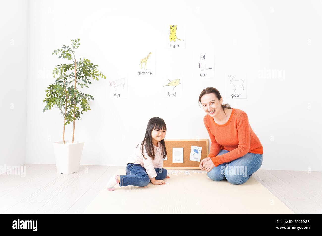 Children taking lessons from a native teacher in an English language ...