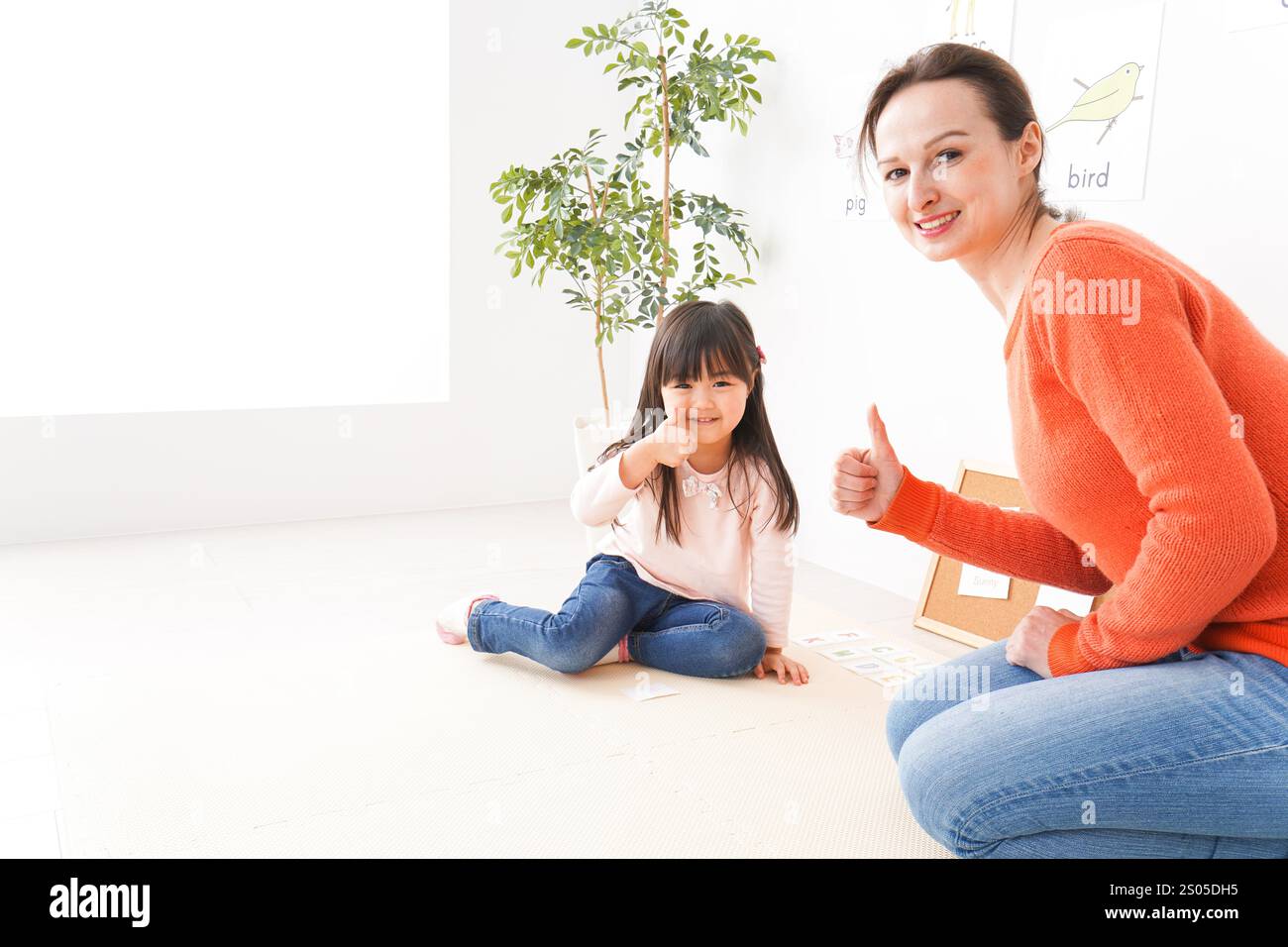 Children taking lessons from a native teacher in an English language ...