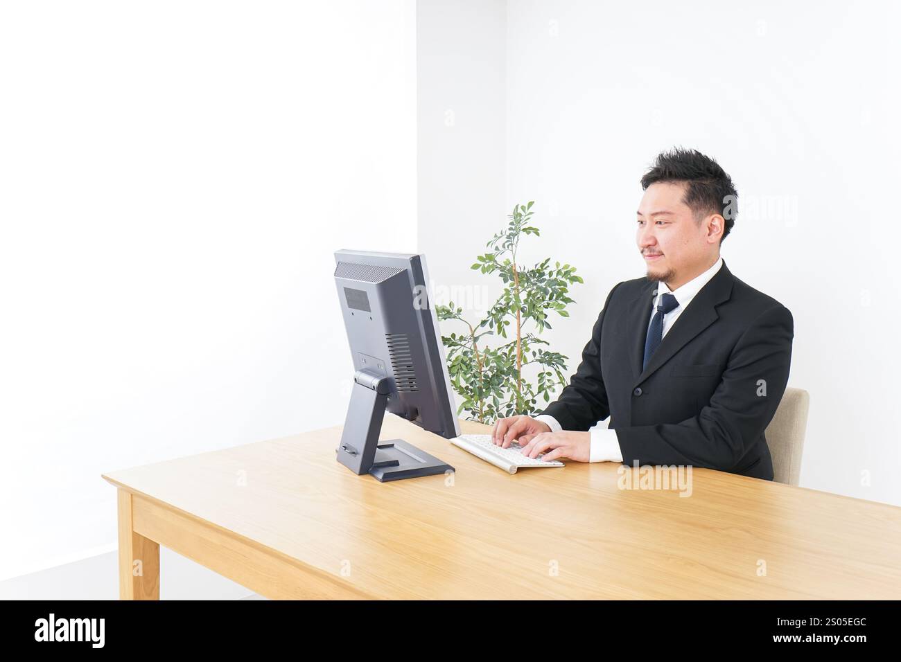 Businessperson with a desk job Stock Photo - Alamy