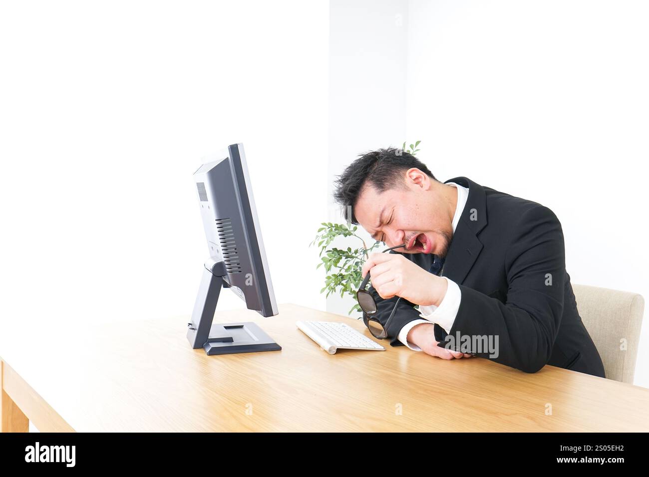 Tired businessman in light blue hi-res stock photography and images - Alamy
