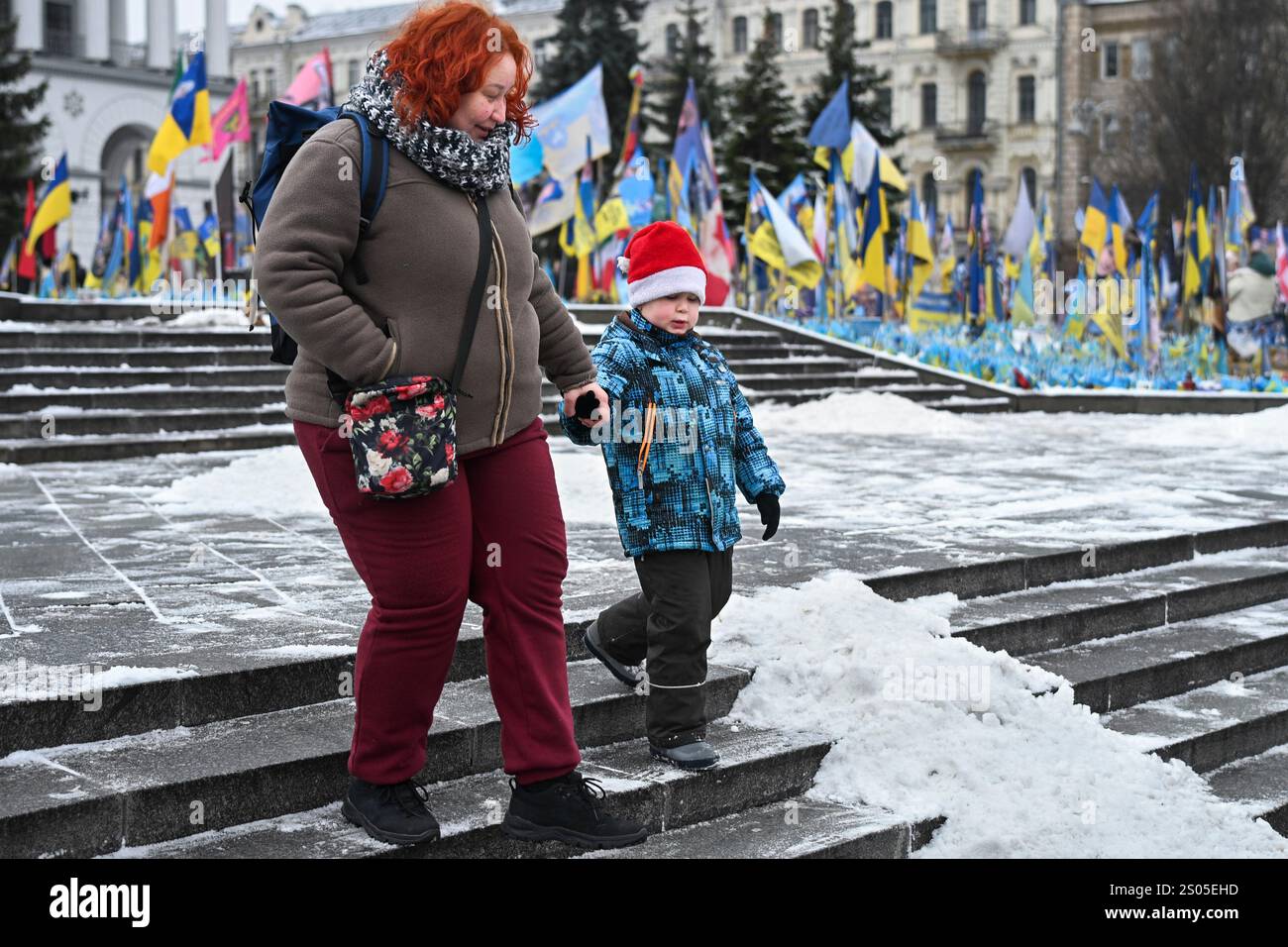 Kyiv, Ukraine. 15th Dec, 2024. A mother and her son, with the boy ...