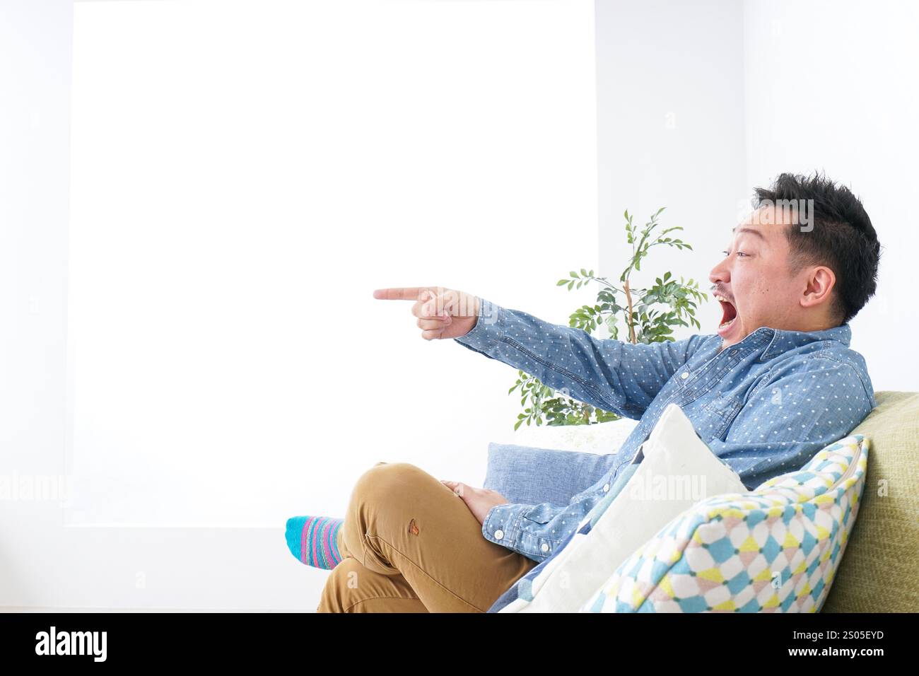 Man relaxing at home Stock Photo - Alamy