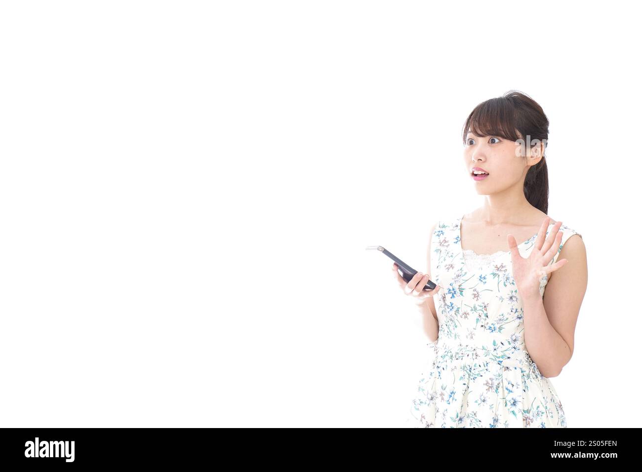 Woman in danger while walking on her phone Stock Photo - Alamy