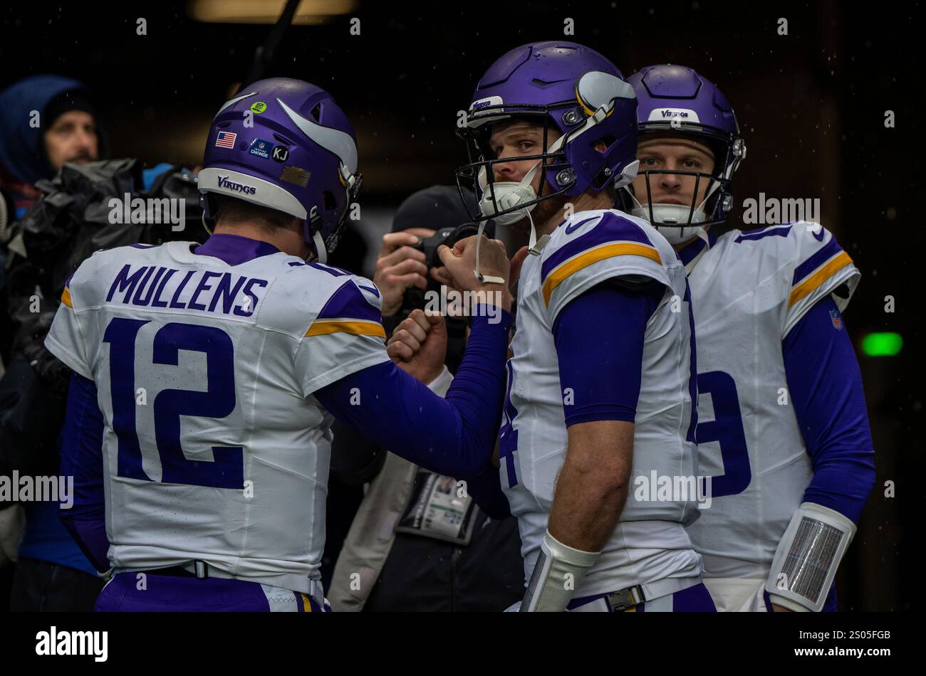Minnesota Vikings quarterback Nick Mullens, lett, quarterback Sam Darnold, center, and ...