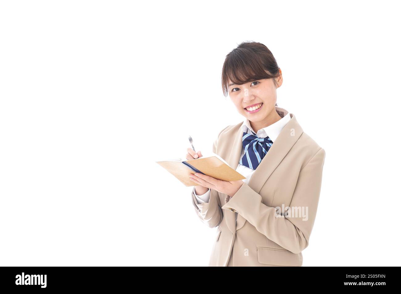 Student taking notes Stock Photo - Alamy