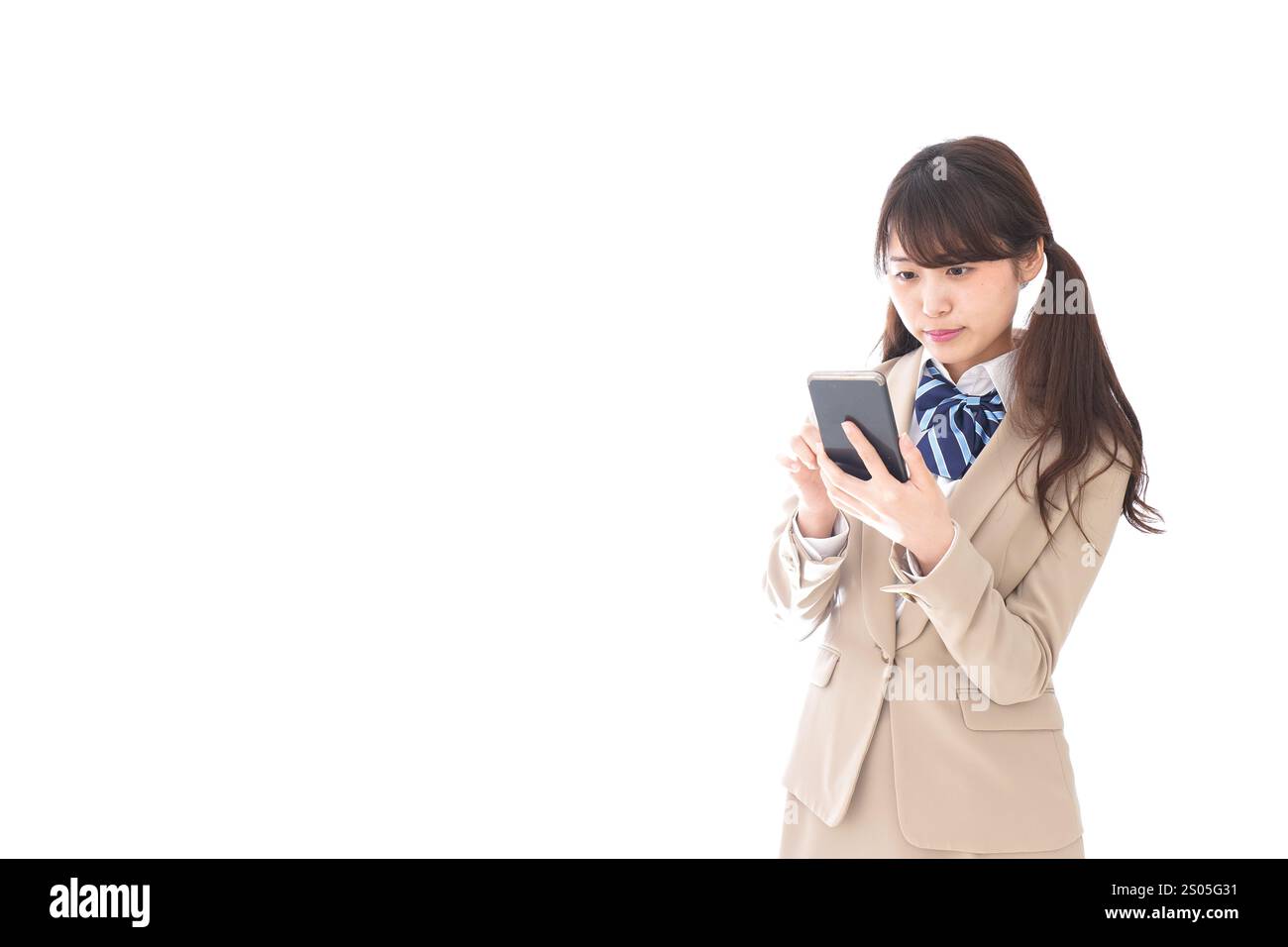 Student in school uniform using a smartphone Stock Photo - Alamy