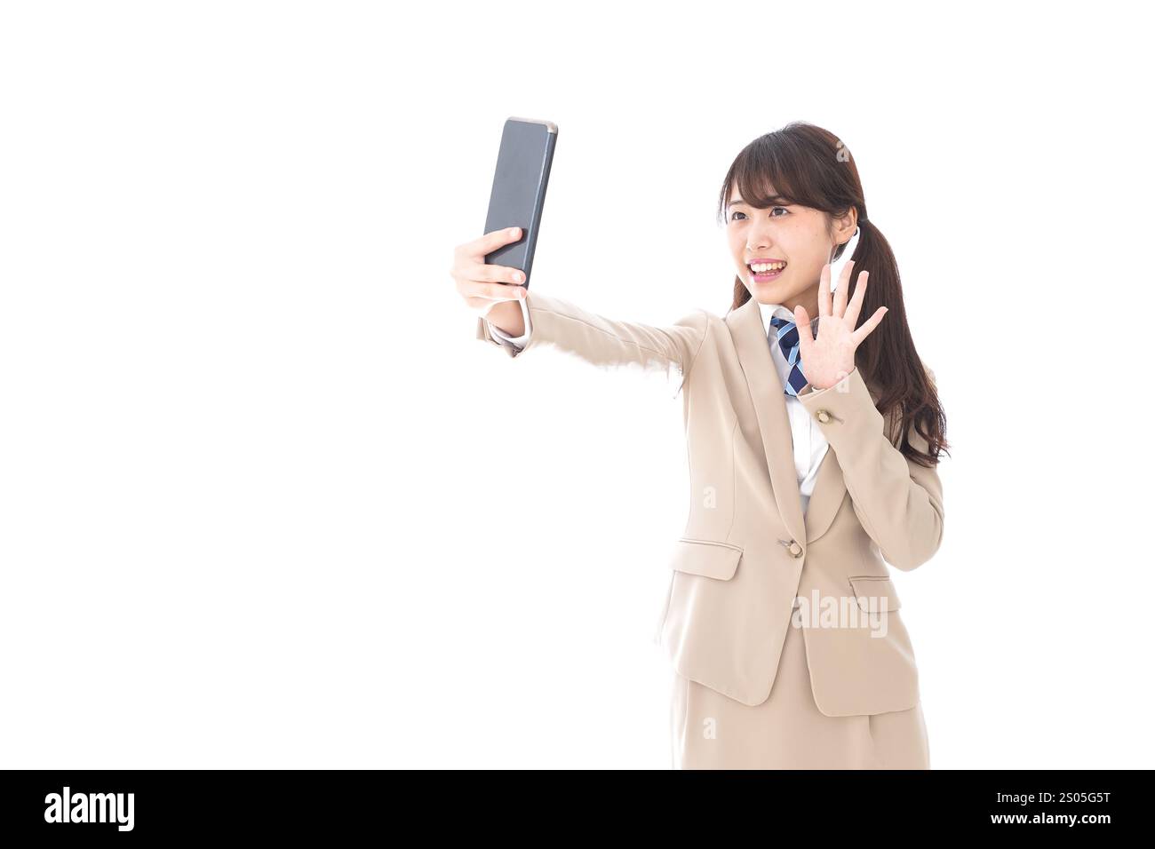 Student in school uniform using a smartphone Stock Photo - Alamy