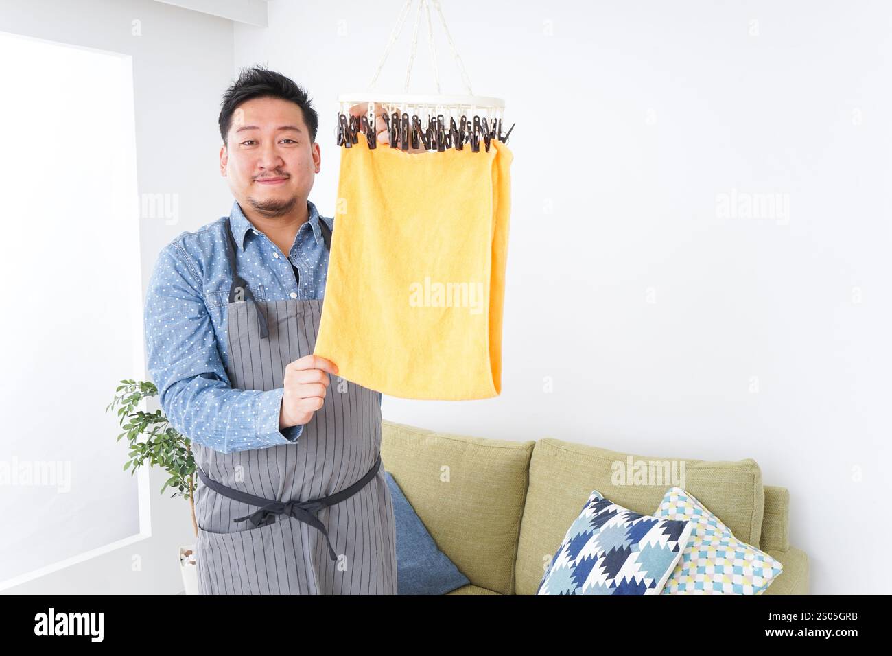 Man doing housework Stock Photo - Alamy