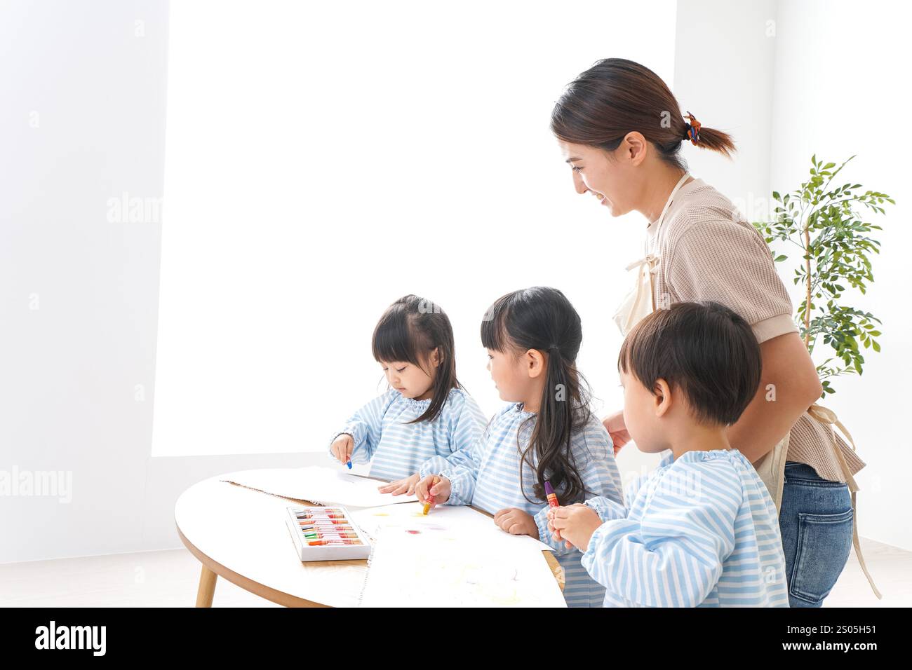 Kindergarten teacher and child Stock Photo - Alamy