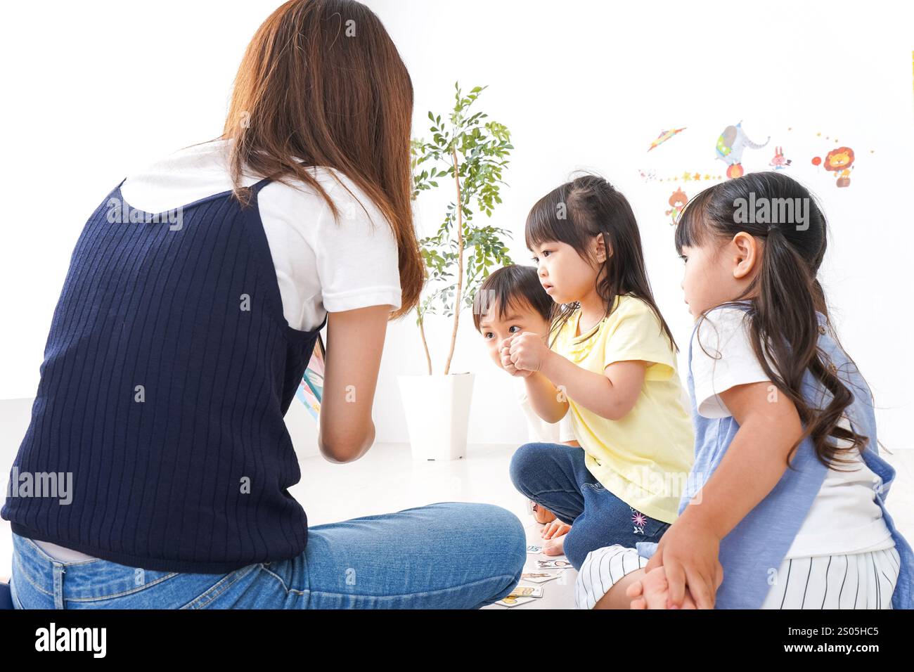 reading a story to a child Stock Photo - Alamy