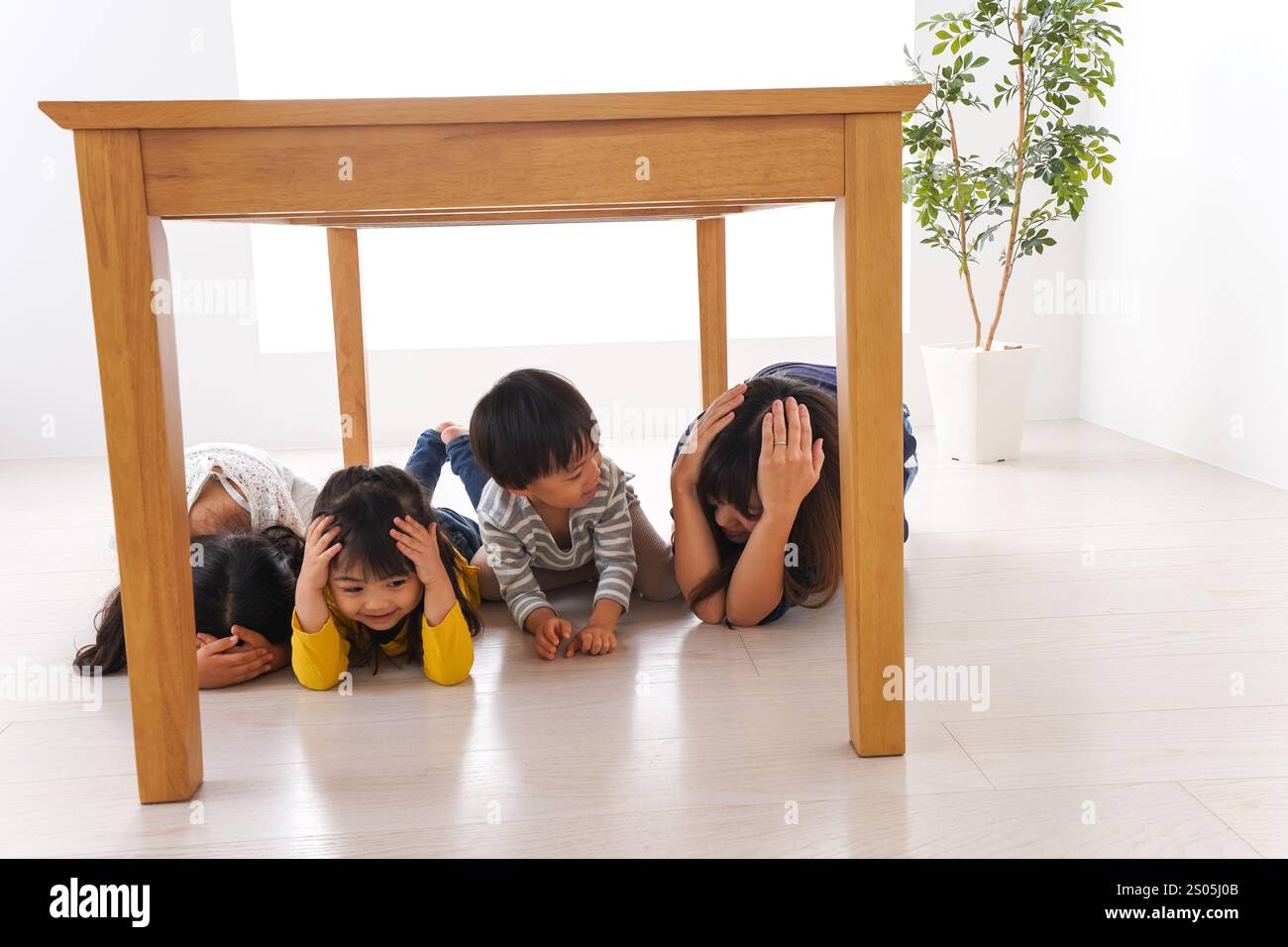 Children taking shelter from earthquake Stock Photo - Alamy