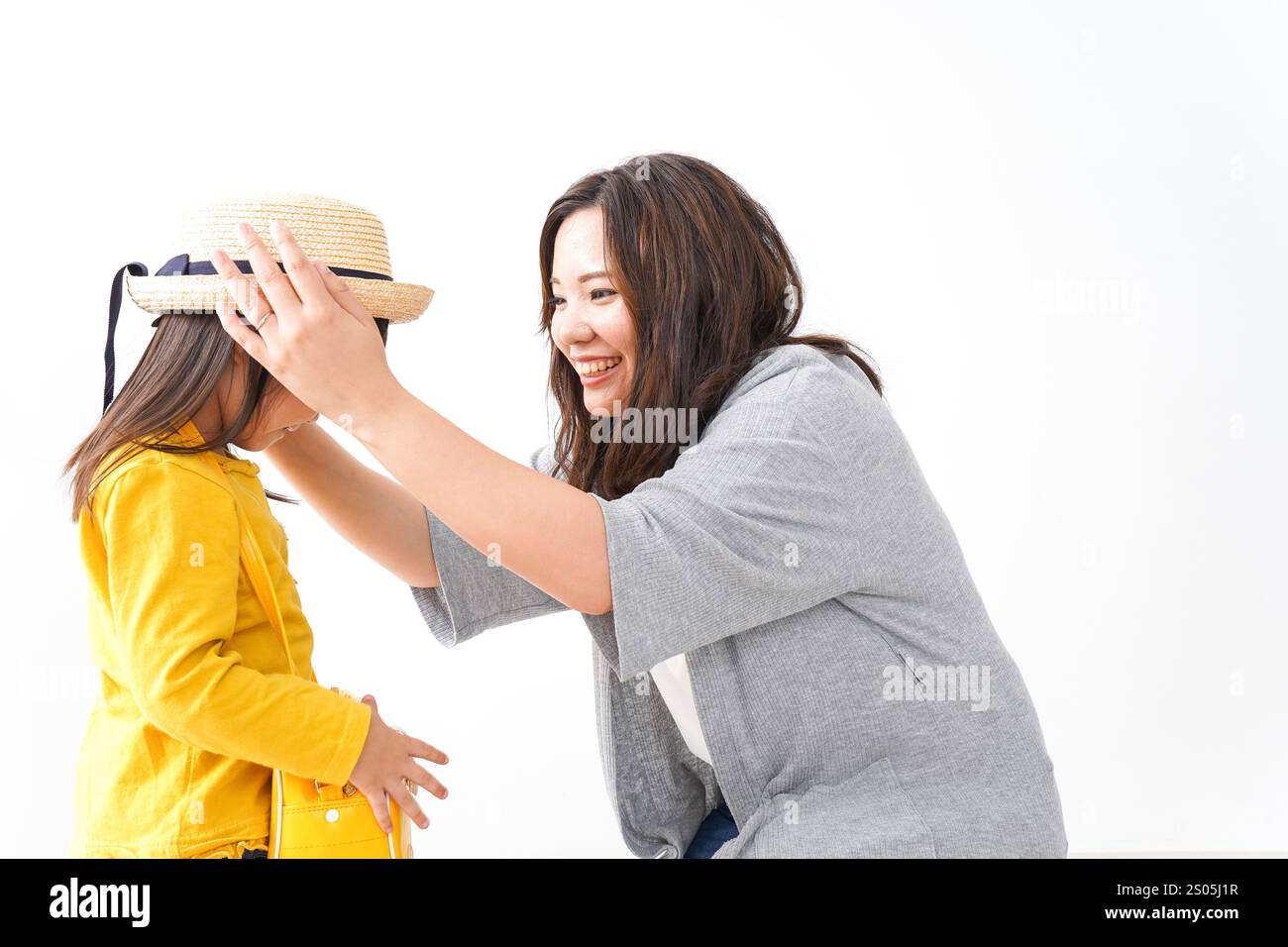 Children going to kindergarten and their mothers seeing them off Stock ...
