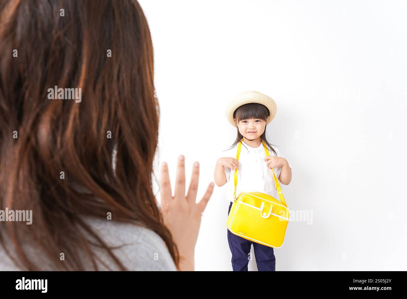 Children going to kindergarten and their mothers seeing them off Stock ...