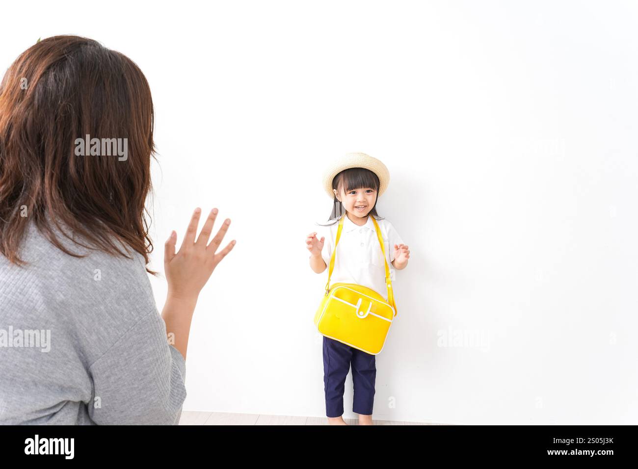 Children going to kindergarten and their mothers seeing them off Stock ...