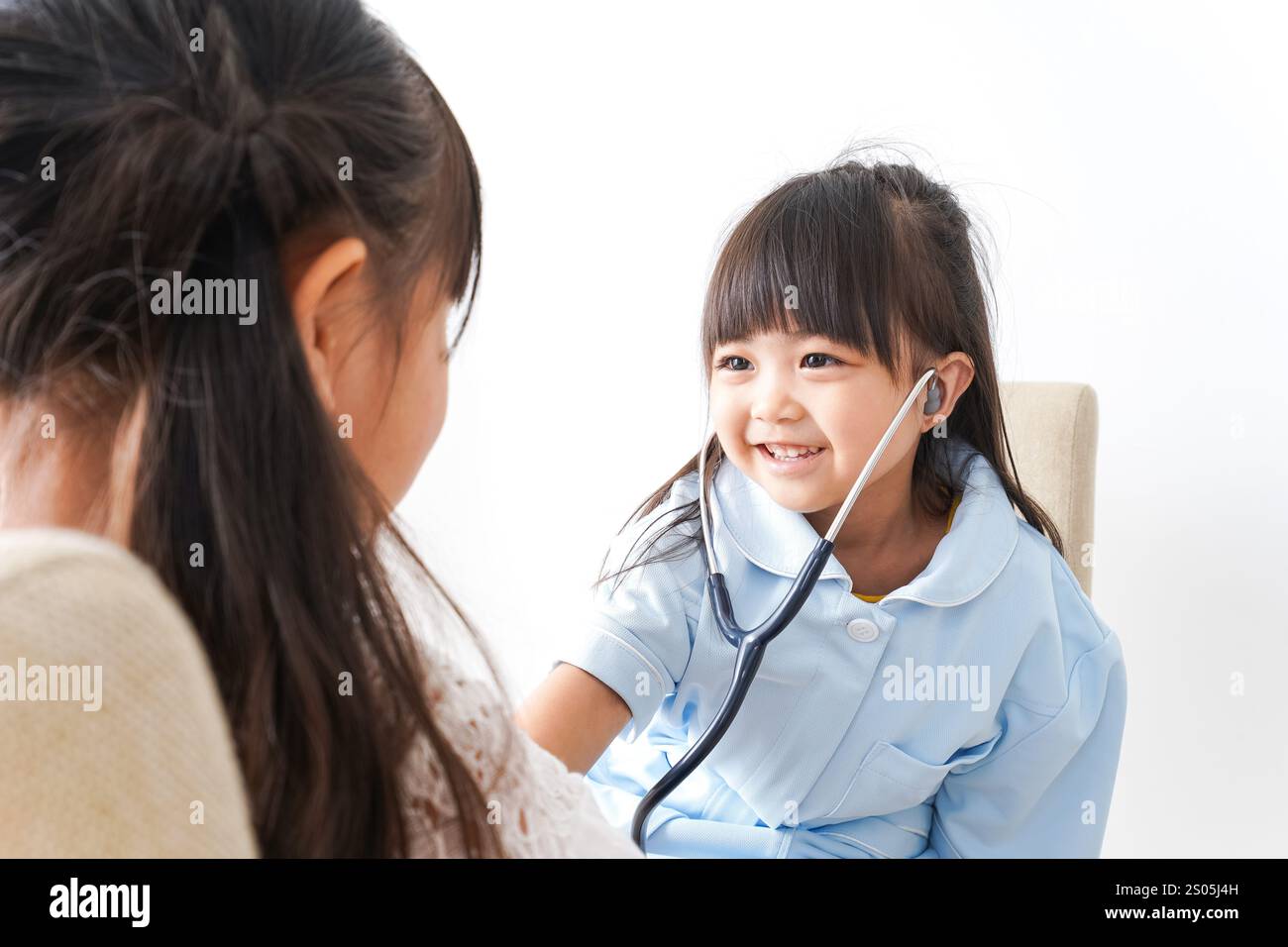 Child playing doctor Stock Photo - Alamy