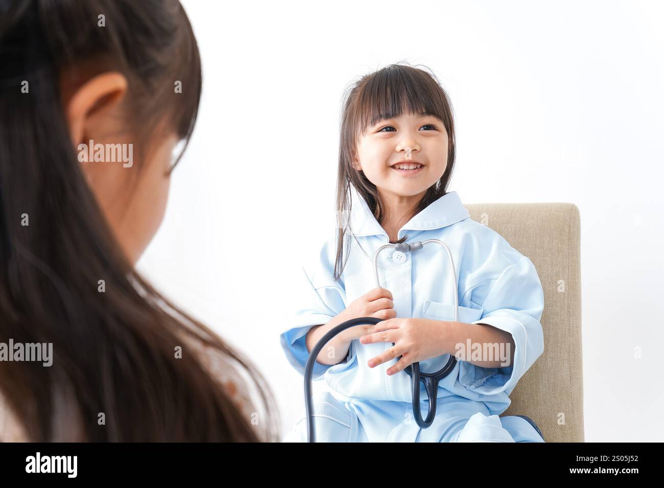 Child playing doctor Stock Photo - Alamy