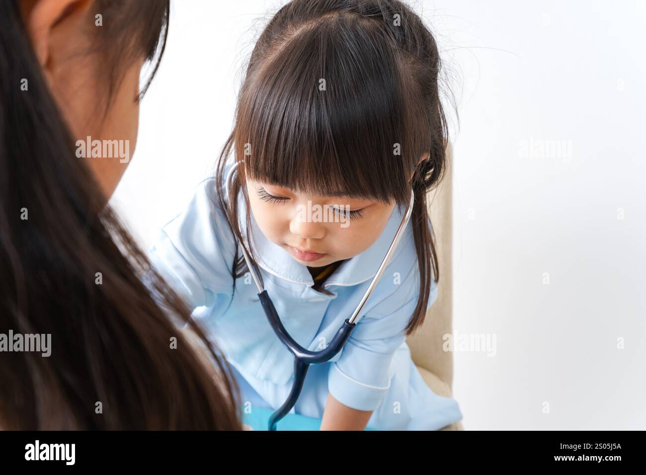 Doctor children game kindergarten hi-res stock photography and images ...