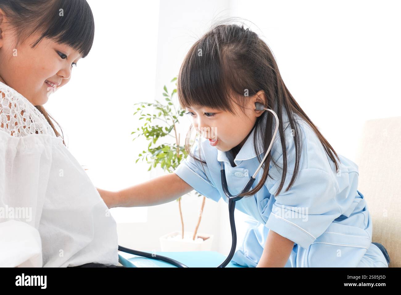 Child playing doctor Stock Photo - Alamy