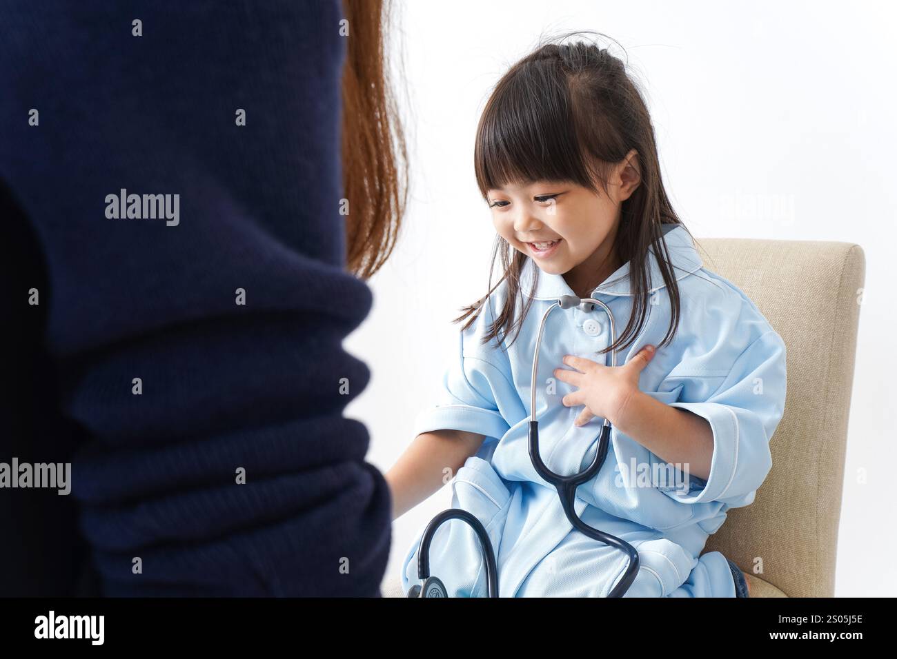 Child playing doctor Stock Photo - Alamy
