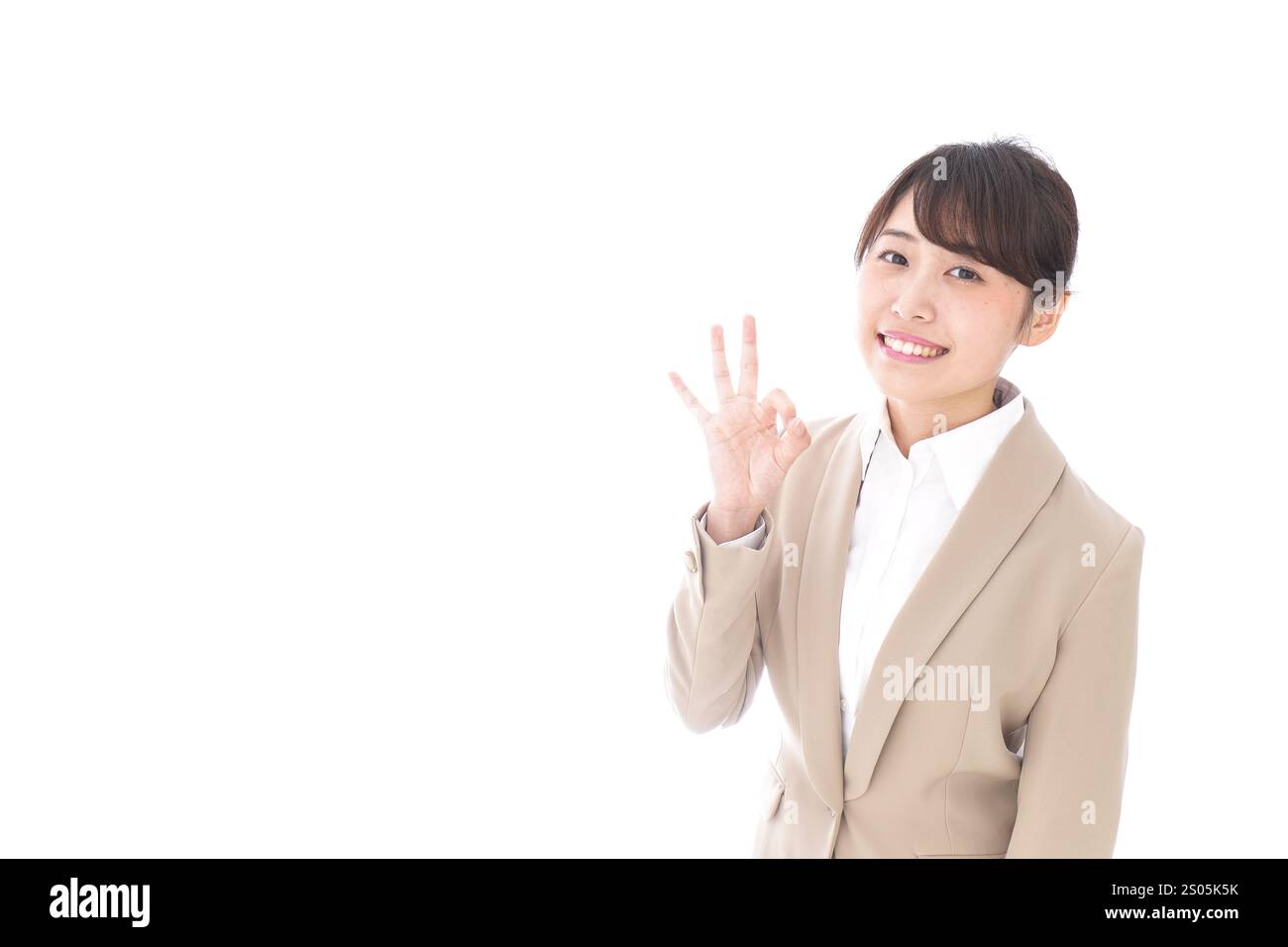 Businesswoman giving the OK sign Stock Photo - Alamy