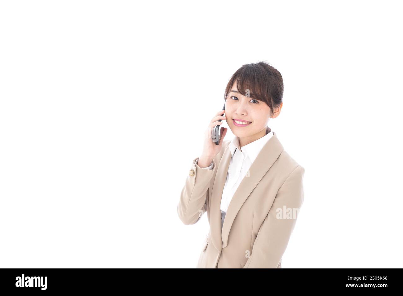 Businesswoman communicating by telephone Stock Photo - Alamy