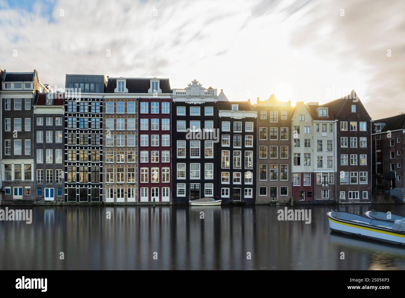 Panoramic view of facades of colorful Amsterdam houses reflecting in ...