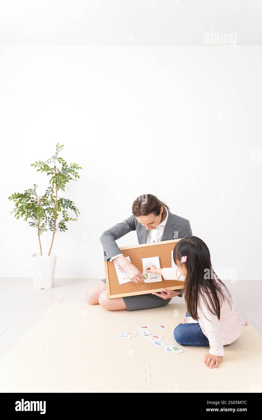 Children taking English conversation lessons Stock Photo - Alamy