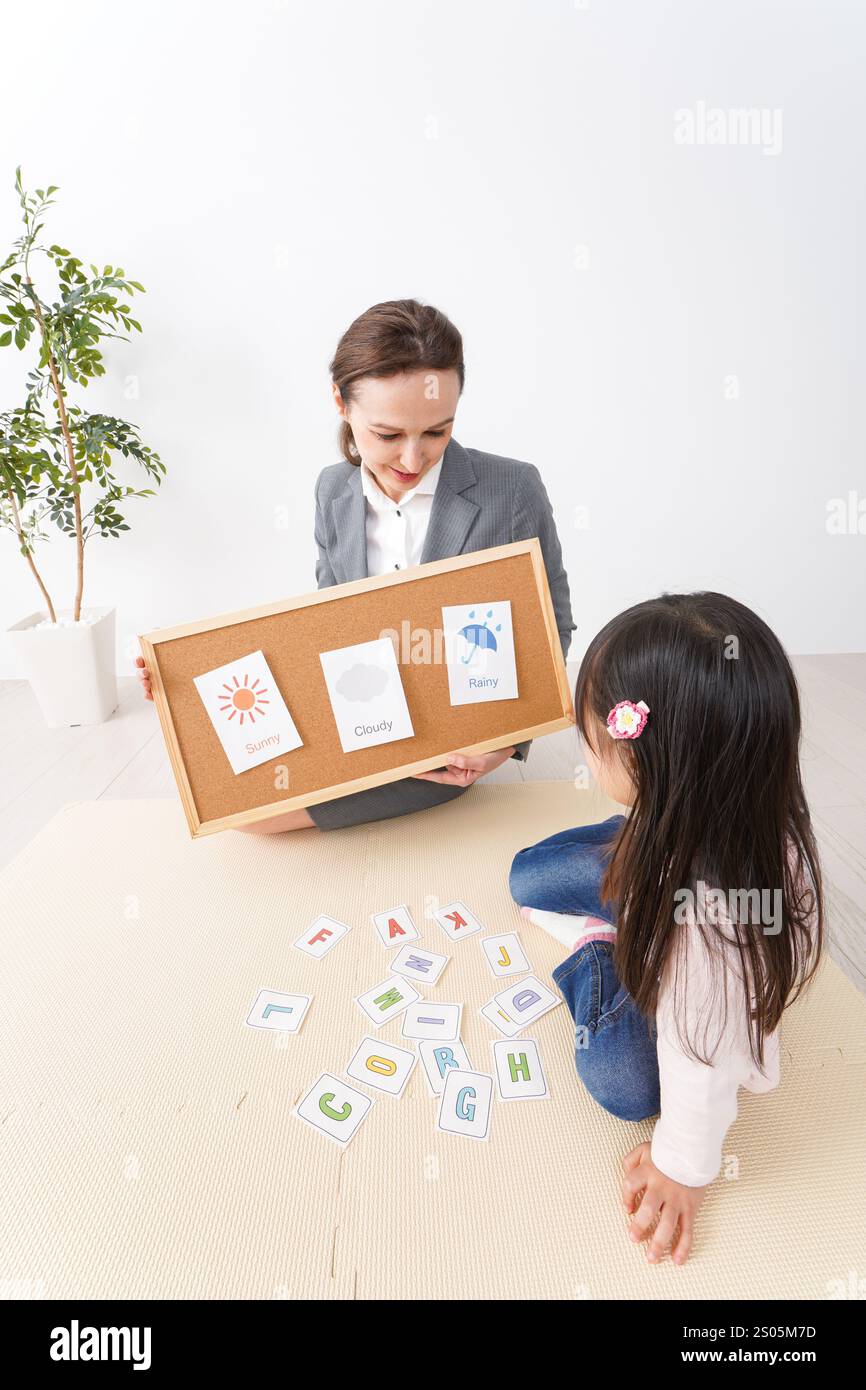 Children taking English conversation lessons Stock Photo - Alamy