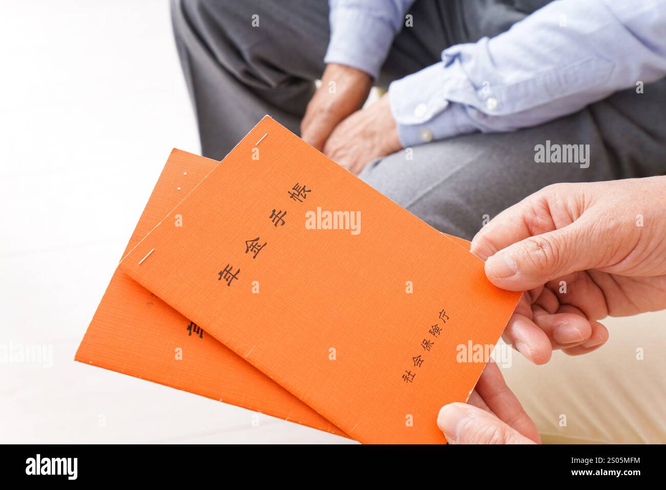 Elderly couple with pension book Stock Photo - Alamy