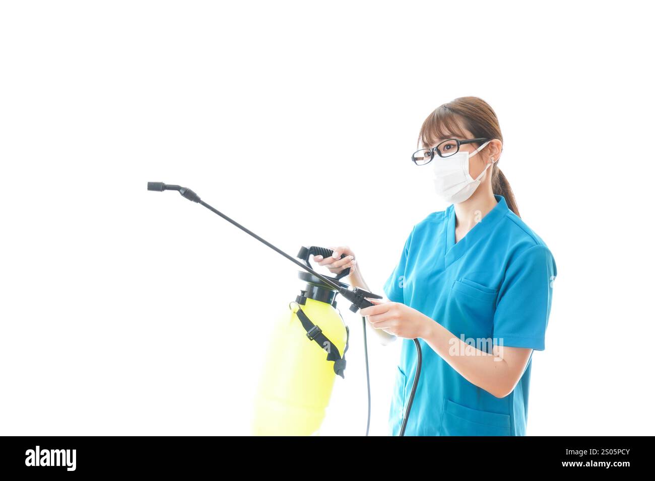 Medical personnel spraying disinfectant solution Stock Photo - Alamy