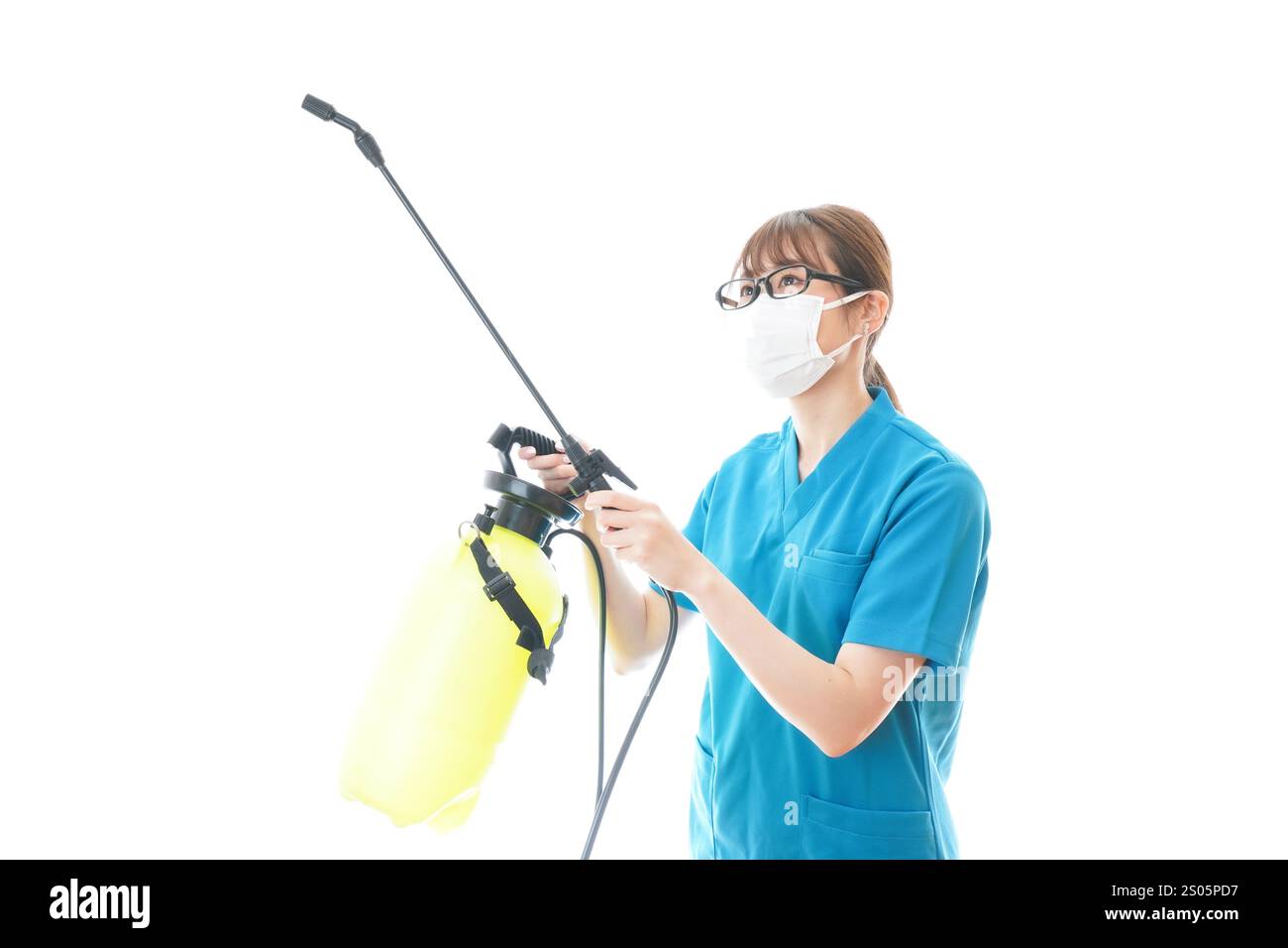Medical personnel spraying disinfectant solution Stock Photo - Alamy