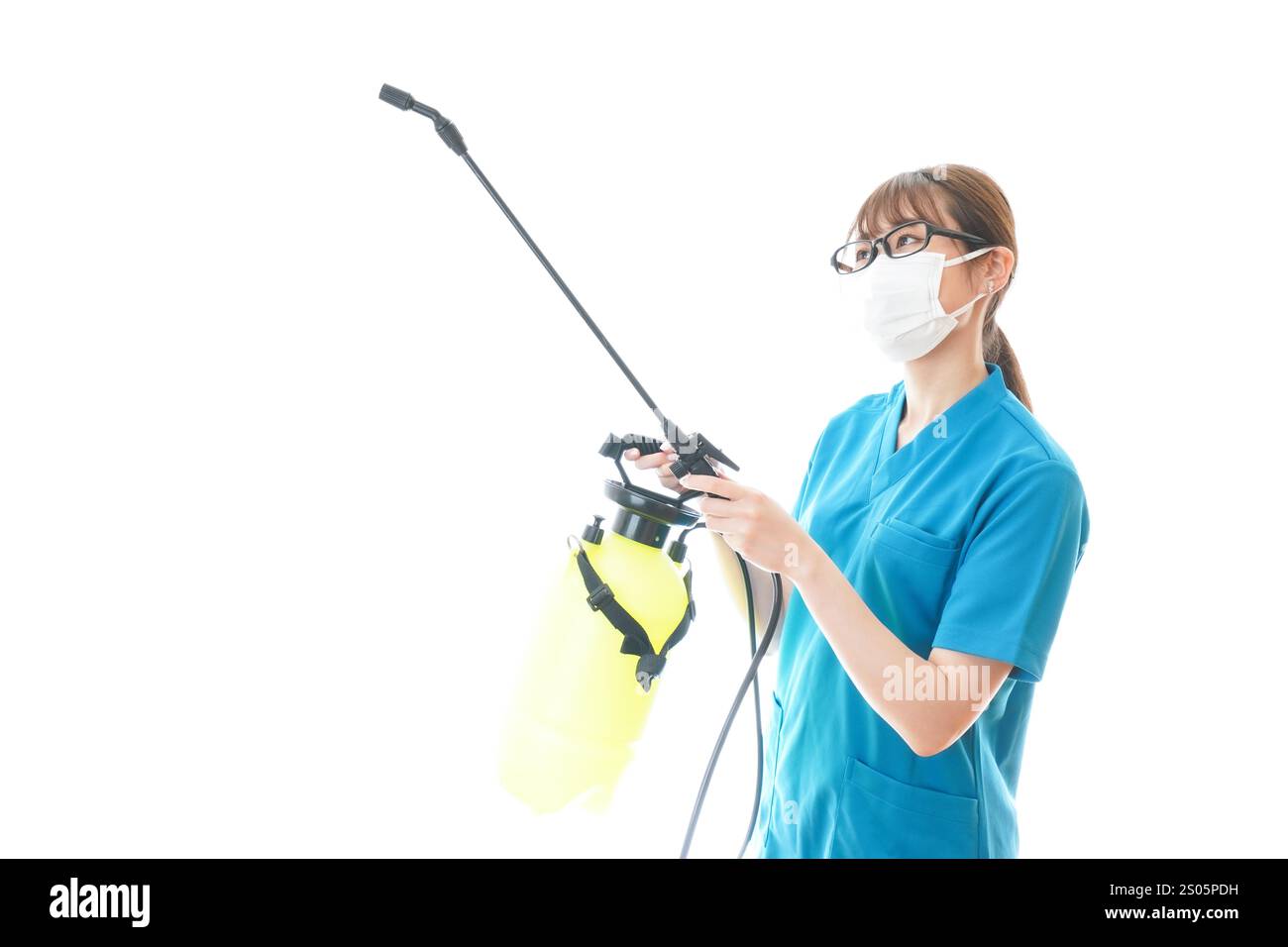 Medical personnel spraying disinfectant solution Stock Photo - Alamy