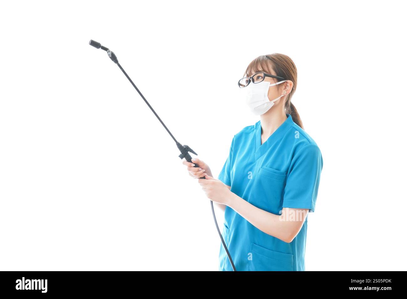 Medical personnel spraying disinfectant solution Stock Photo - Alamy