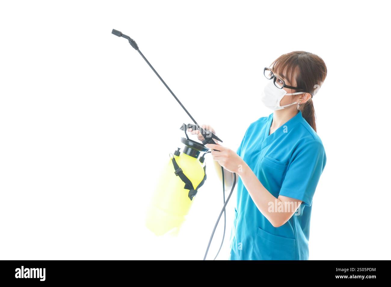 Medical personnel spraying disinfectant solution Stock Photo - Alamy