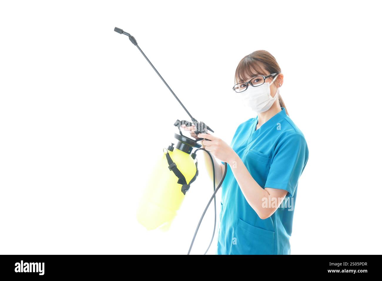 Medical personnel spraying disinfectant solution Stock Photo - Alamy