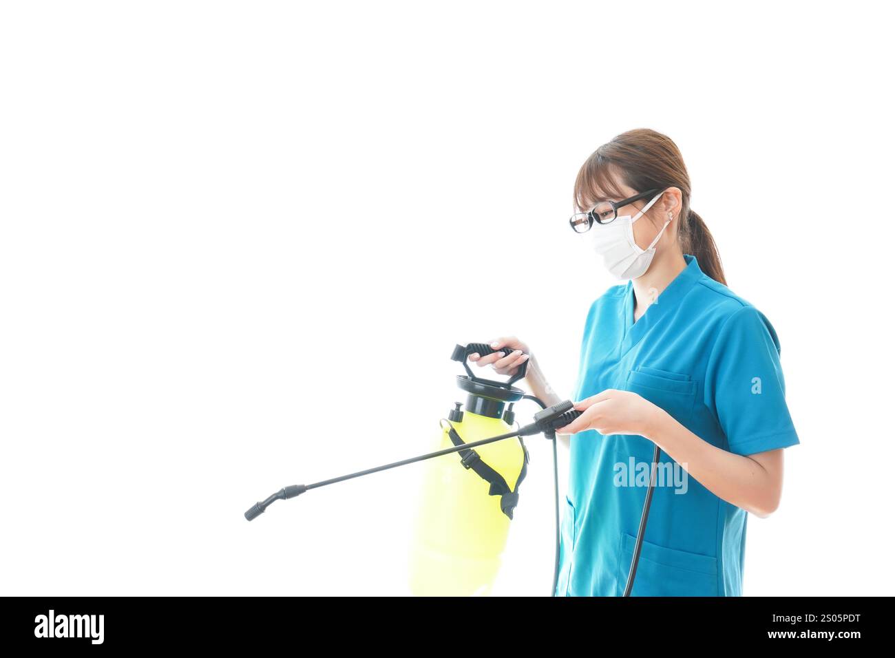 Medical personnel spraying disinfectant solution Stock Photo - Alamy
